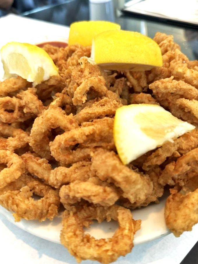 Calamari so light and crispy, it makes you forget you're eating something that once swam in the ocean. Those lemon wedges aren't just garnish&mdash;they're essential.