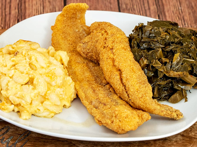 Southern comfort on a plate&mdash;crispy catfish flanked by mac and cheese and collard greens. Soul food that speaks directly to your soul.
