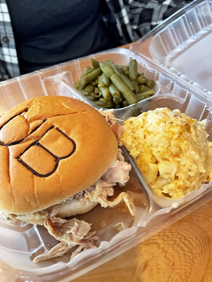This pulled chicken sandwich with its branded bun isn't just lunch&mdash;it's edible artwork with mac 'n cheese that could make a southerner weep with joy.