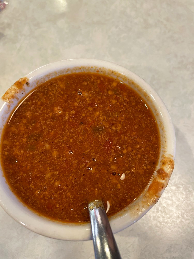 A bowl of chili that's having a serious conversation with your taste buds&mdash;spicy, complex, and exactly what you'd hope to find in a proper American diner.