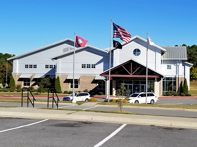 The community center flies its flags with pride. In Heber Springs, "community" isn't just part of the building's name &ndash; it's the town's operating system.