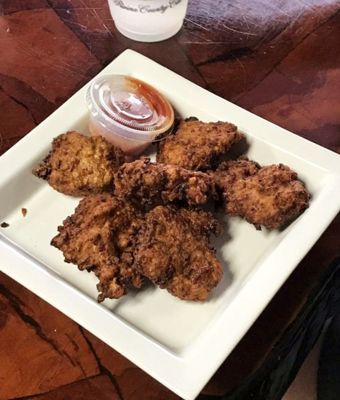These conch fritters aren't just fried – they're little golden orbs of Florida tradition that crunch, then melt in your mouth.