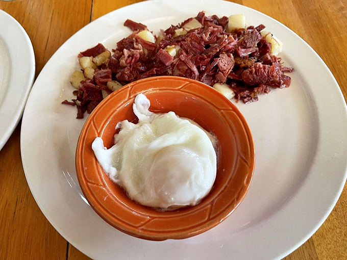 Corned beef hash with a perfectly poached egg&mdash;the breakfast of champions and late-risers alike. Simple perfection on a plate.