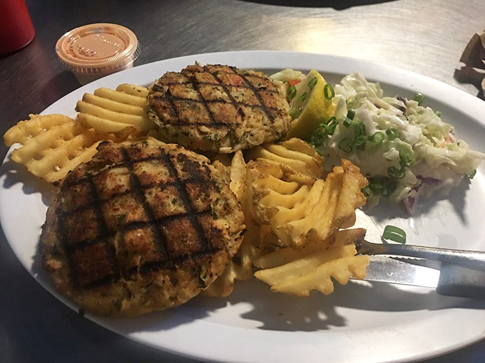 These crab cakes aren't hiding behind fillers &ndash; they're proudly showcasing their crab meat credentials alongside those signature waffle fries.