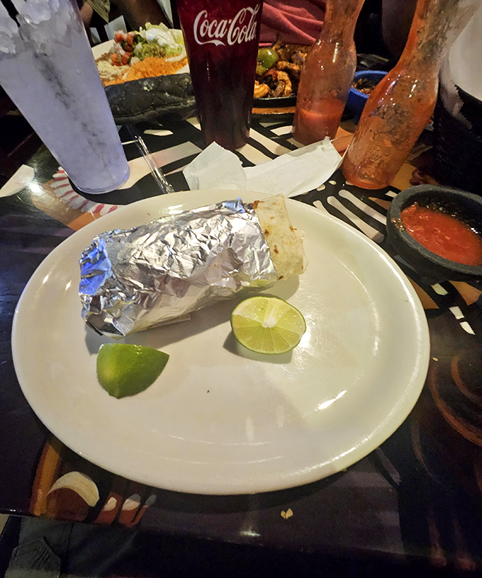 Foil-wrapped happiness waiting to be unleashed. This burrito comes with lime wedges that aren't just garnish&mdash;they're essential supporting actors.