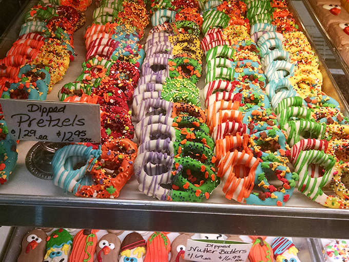 Chocolate-dipped pretzels lined up like colorful soldiers in a sugar parade—the perfect sweet-salty contradiction that somehow makes perfect sense.