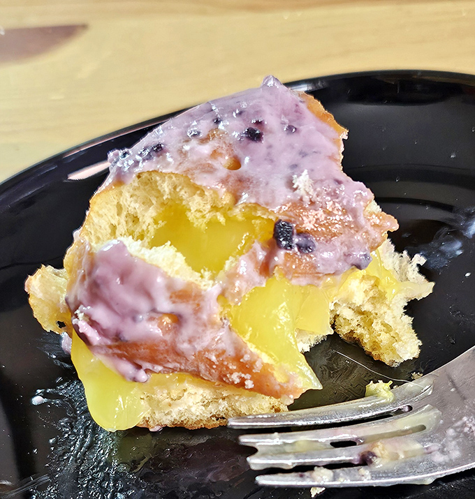 This isn't just a donut with filling—it's a portable joy delivery system with a flavor surprise waiting in the middle.