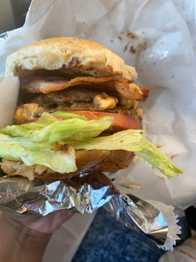 Layer upon layer of beef, cheese, and fresh toppings&mdash;this isn't just a burger, it's an architectural achievement worthy of a Cleveland landmark.