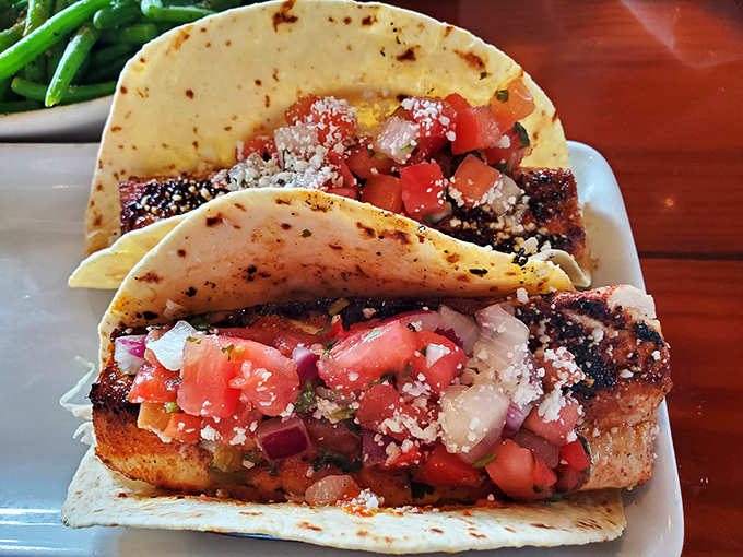 Fish tacos that make you question every taco decision you've made before – blackened fish, fresh toppings, and tortillas that mean business.