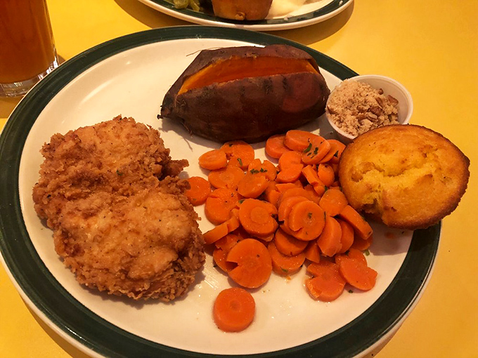 Fried chicken that's crunchier than the excuses you'll make to your diet tomorrow. Those carrots are just there to ease your conscience.