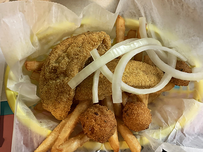 Golden-brown catfish that's cornmeal-crusted to perfection – proof that simple food done right is worth crossing county lines for.
