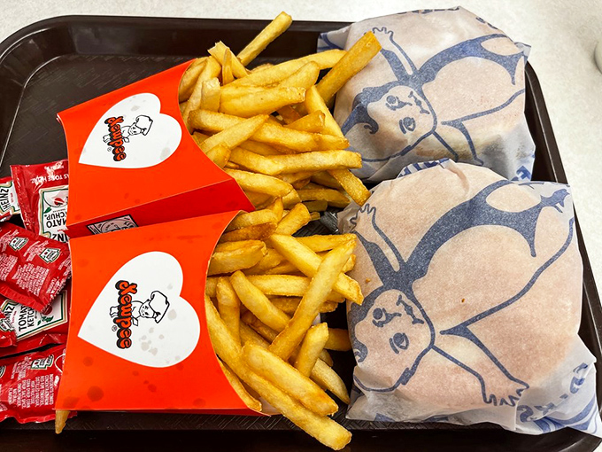 The perfect tray doesn't exi— Oh wait, here it is: golden fries flanking wrapped burgers like delicious bodyguards protecting precious cargo.