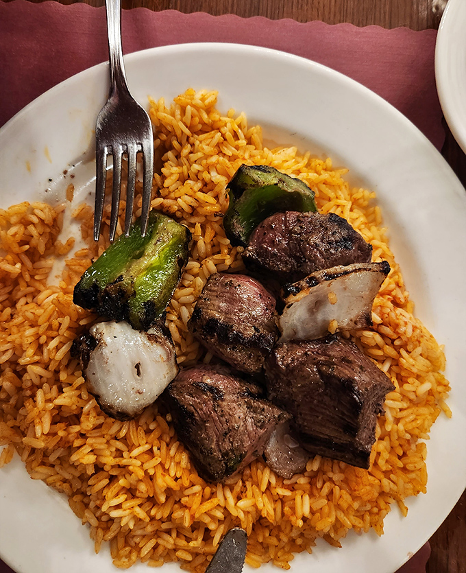 The beef tenderloin kabob resting on a bed of seasoned rice&mdash;proof that sometimes the simple things in life are the most extraordinary.