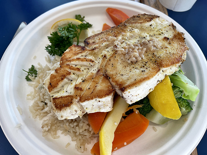 Perfectly grilled halibut that flakes at the mere suggestion of a fork, served with the kind of simple vegetables that know their supporting role.