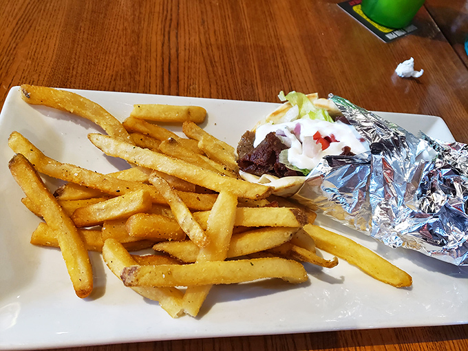 When a sandwich and fries look this good, you know you're in for a treat. The foil-wrapped gyro promises Mediterranean flavors with Pennsylvania hospitality.