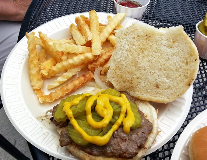 Some places garnish with sprigs of herbs; Wedl's goes straight for the good stuff—pickles and mustard on a classically prepared burger.
