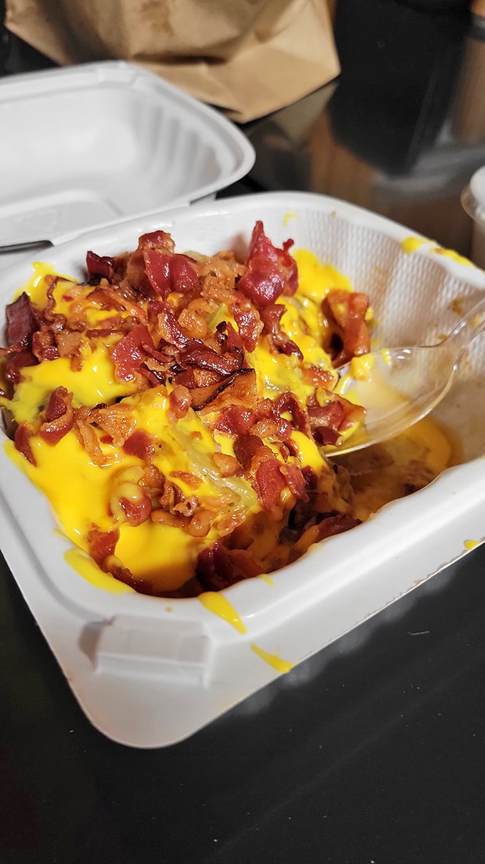 Home fries smothered in melted cheese and crispy bacon bits&mdash;proof that potatoes achieve their highest purpose at Helen's.
