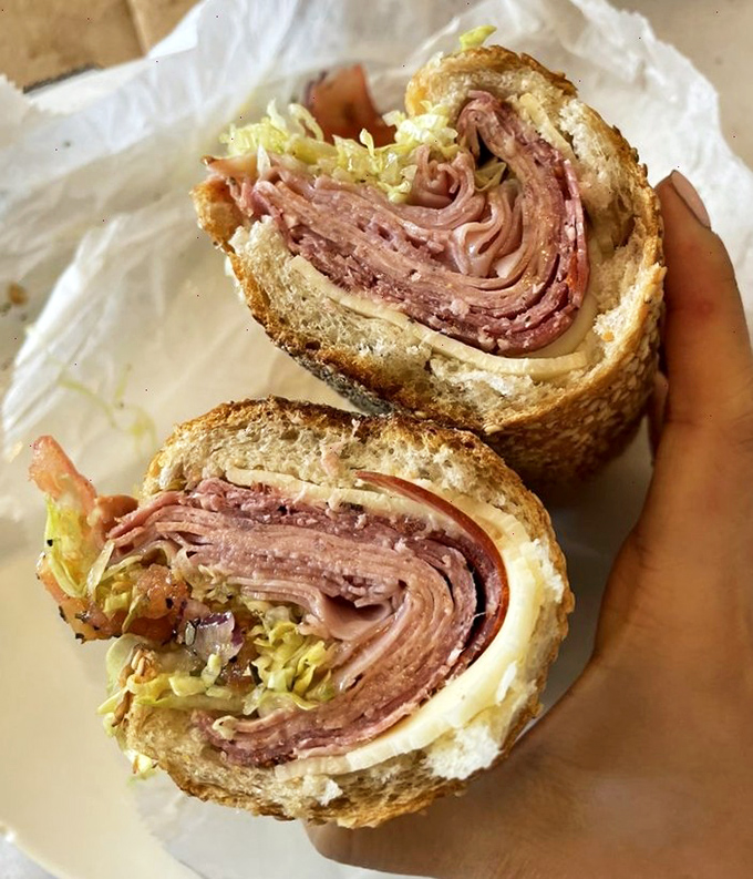 The Italian hoagie that haunts your dreams. Layers of thinly sliced meats, sharp provolone, and crunchy vegetables create a sandwich architecture that defies gravity and expectations.