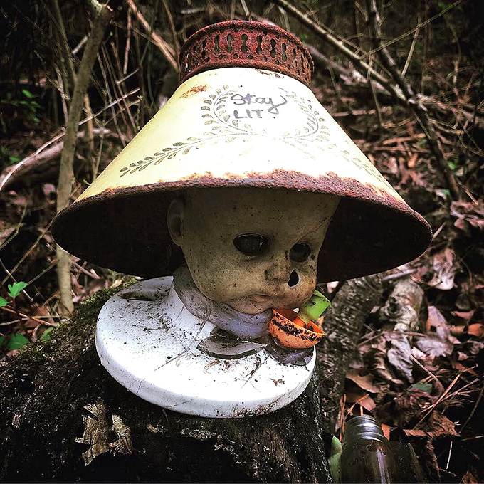 "Stay awhile," this weathered doll seems to say from beneath its makeshift lampshade hat. Southern hospitality takes an unusual turn.