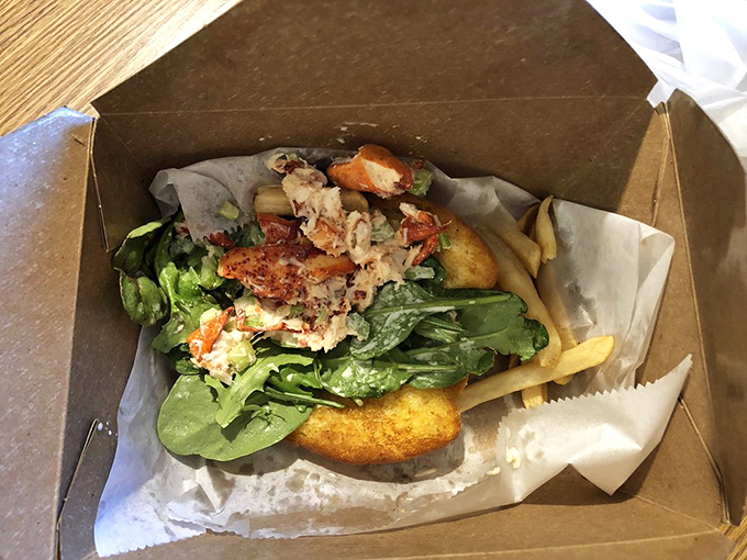 This isn't just lunch&mdash;it's edible architecture. Fresh ingredients nestled in a takeout container prove good things come in humble packages.