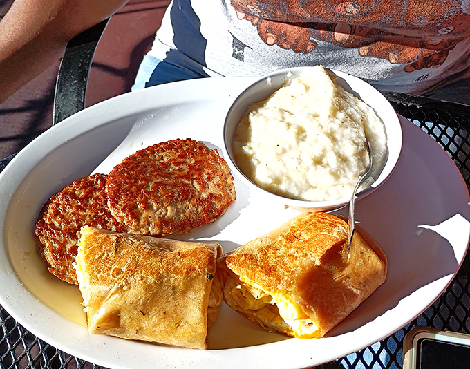 The star of the show: creamy mashed potatoes smothered in gravy, with eggs and sausage playing worthy supporting roles in this comfort food symphony.