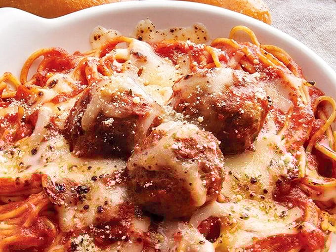 These meatballs nestled in sauce and blanketed with melted cheese are the kind of comfort food that makes you want to hug whoever invented the combination.