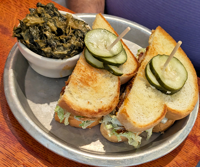 A sandwich that demands two hands and your undivided attention, with those house-made pickles adding the perfect tangy counterpoint.