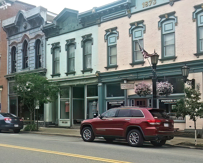 These storefronts aren't playing dress-up&mdash;they're the real architectural deal. The "1873" etched above speaks to craftsmanship that's stood the test of time.