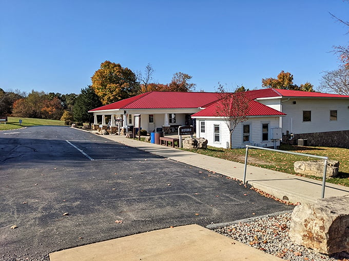 The welcoming visitor center with its distinctive red roof serves as the gateway between ordinary Ohio farmland and the extraordinary world below.