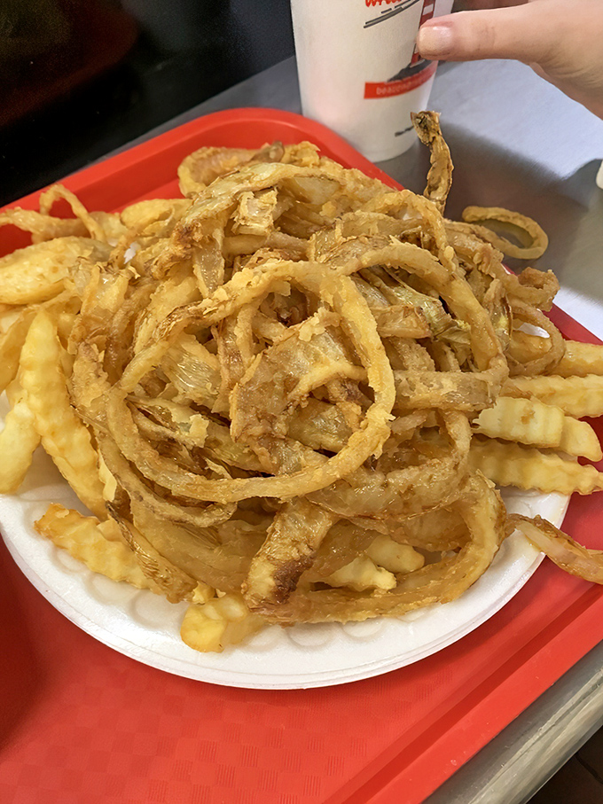 These aren't just onion rings&mdash;they're golden halos of happiness stacked higher than your weekend to-do list will ever be.