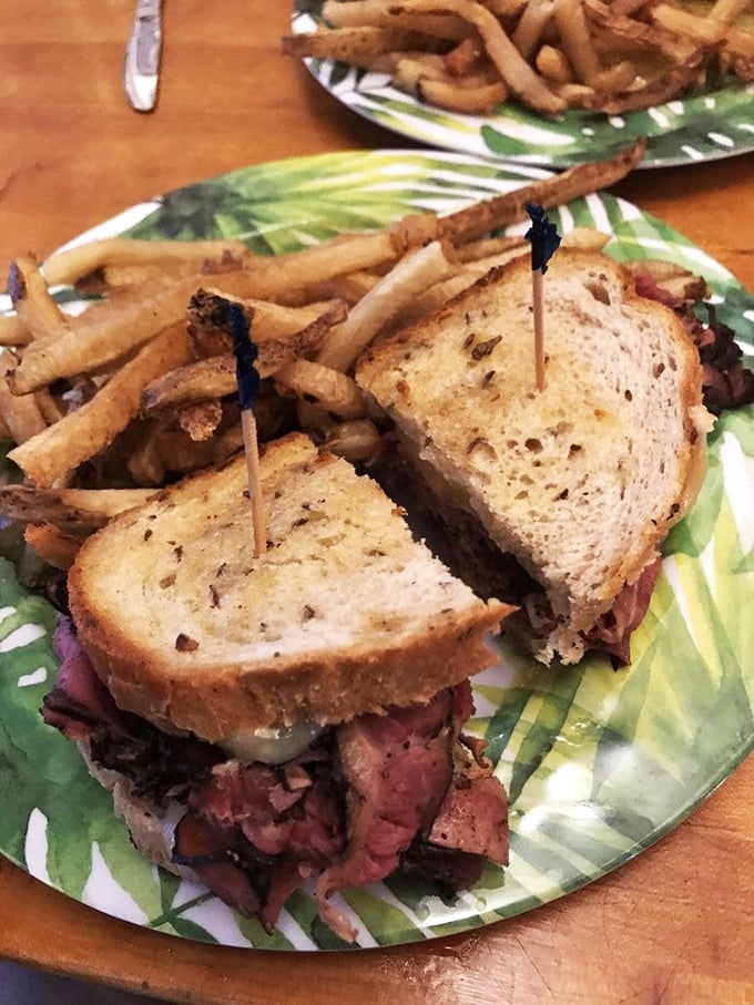 The pastrami sandwich that launched a thousand food dreams. Tender meat piled high between grilled rye with fries that deserve their own fan club.