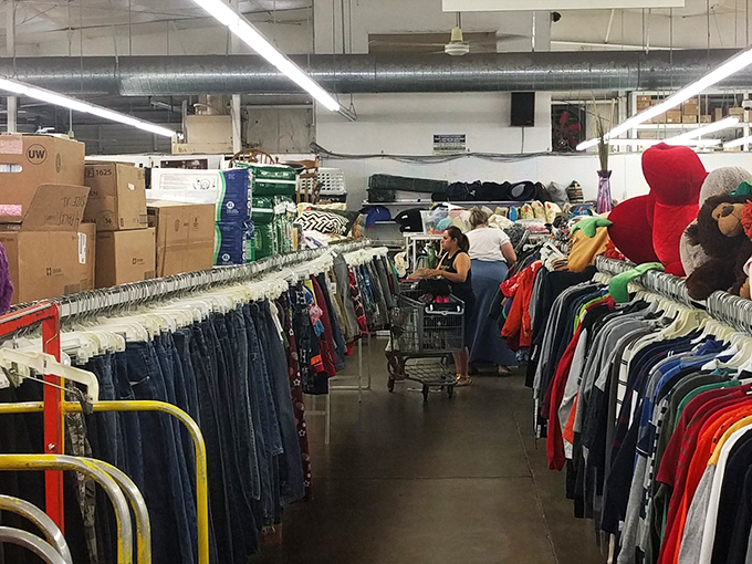 The thrill of the hunt in action. Shoppers navigate the clothing forest with the focus of truffle-hunting experts.