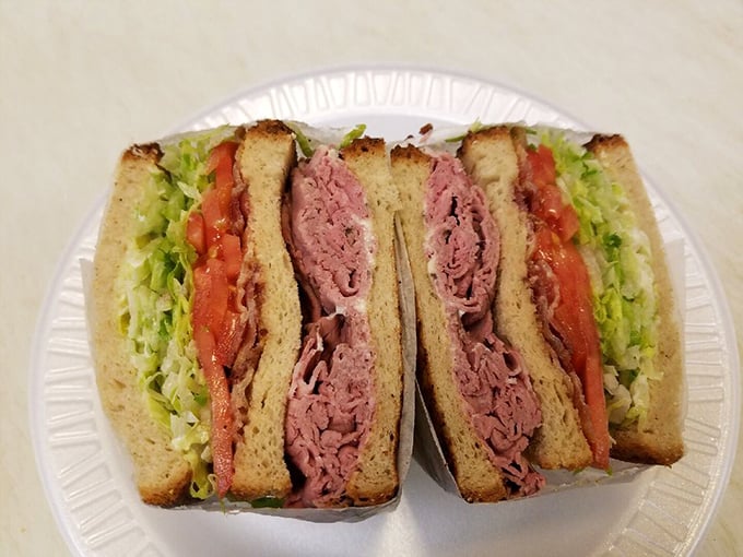 This isn't just a sandwich; it's architectural perfection&mdash;layers of fresh vegetables, perfectly stacked meat, and bread that knows its supporting role.
