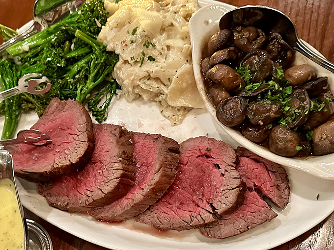 Perfectly pink slices arranged like a carnivore's color wheel, paired with mushrooms that have clearly found their life's purpose.