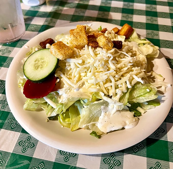 Even the salad plays its supporting role with dignity, offering a moment of green respite before the main event.