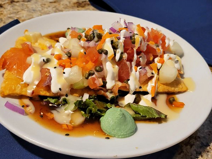 A salmon dish dressed to impress, layered with vibrant toppings that make your average fish entrée seem like it's not even trying.