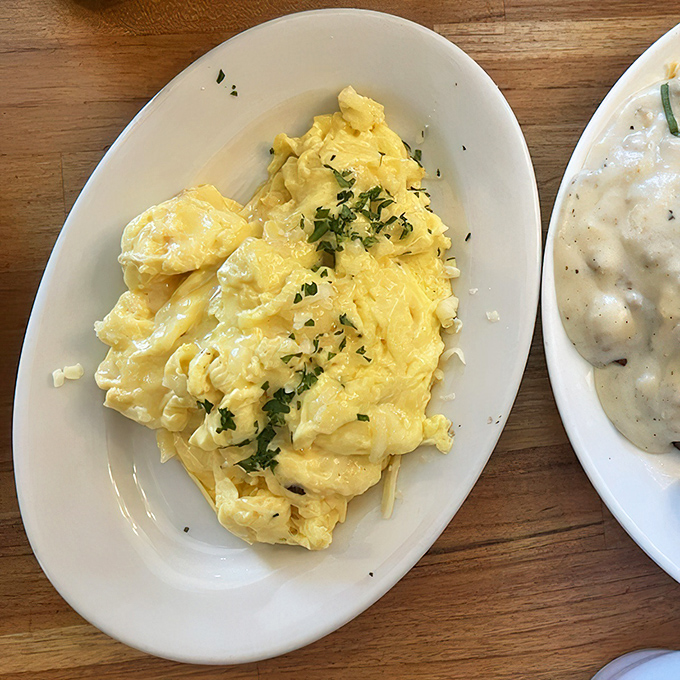 These aren't just scrambled eggs; they're fluffy pillows of morning sunshine that make hitting the snooze button seem like a criminal offense.