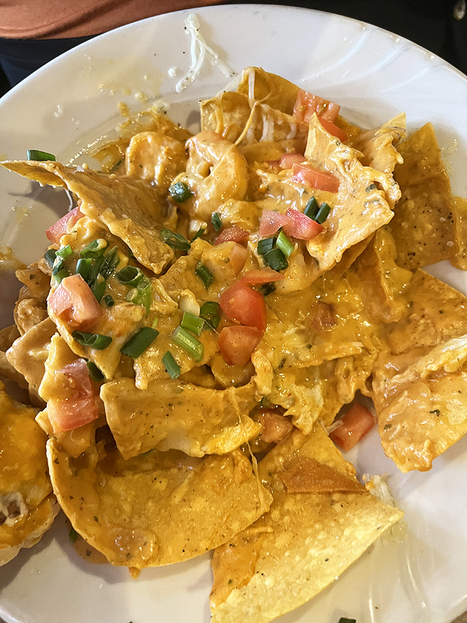 Seafood nachos that break all the rules in the best possible way – crispy chips smothered in creamy seafood goodness.