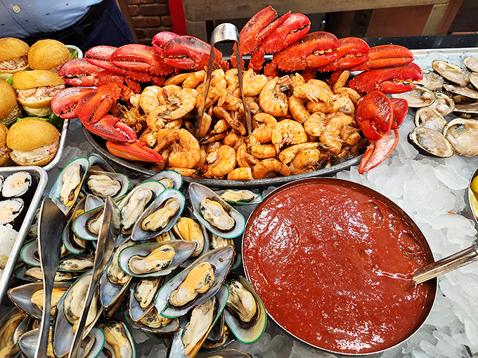 A seafood lover's fantasy realized: lobster claws, plump shrimp, and fresh mussels surrounding a cocktail sauce lake that begs for diving.