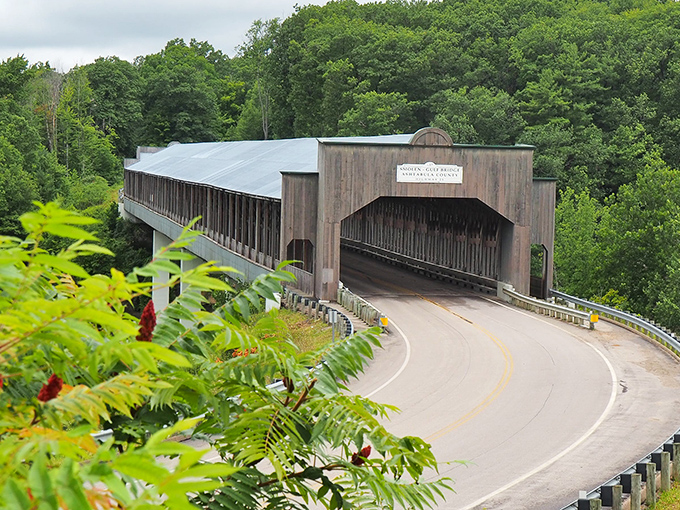 Covered bridges aren't just for postcards&mdash;they're for actual driving, as evidenced by this wooden wonder embracing a modern road.