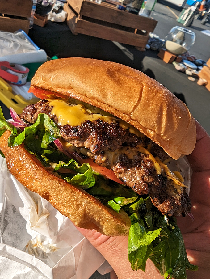 Behold the architecture of joy &ndash; melted cheese cascading over a hand-formed patty, fresh lettuce, and a perfectly toasted bun. Simplicity elevated to an art form.