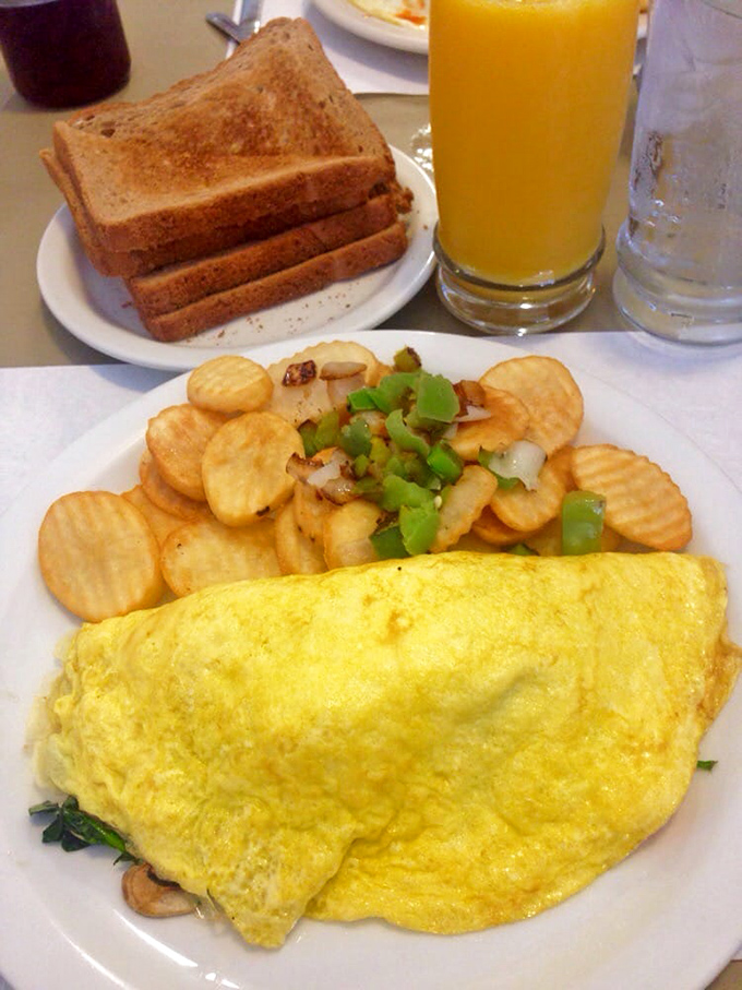 This omelet doesn't just contain spinach and mushrooms&mdash;it celebrates them in a fluffy egg embrace that would make Popeye weep with joy.