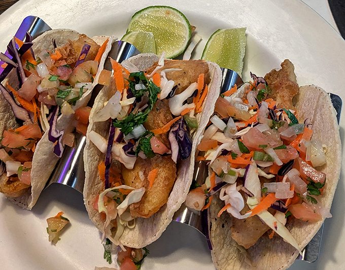 Fish tacos that bring coastal vibes to landlocked Utah, dressed in a confetti of fresh vegetables and waiting for a squeeze of lime.