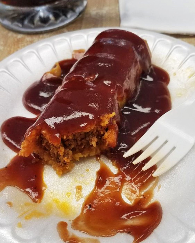 The tamale smothered in chili sauce isn't trying to win beauty contests—it's too busy winning the hearts of Midwesterners one bite at a time.