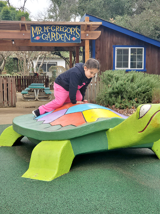 In Mr. McGregor's Garden, this colorful turtle sculpture offers more than just a photo op—it's a chance to literally climb on the back of a slow-moving legend.