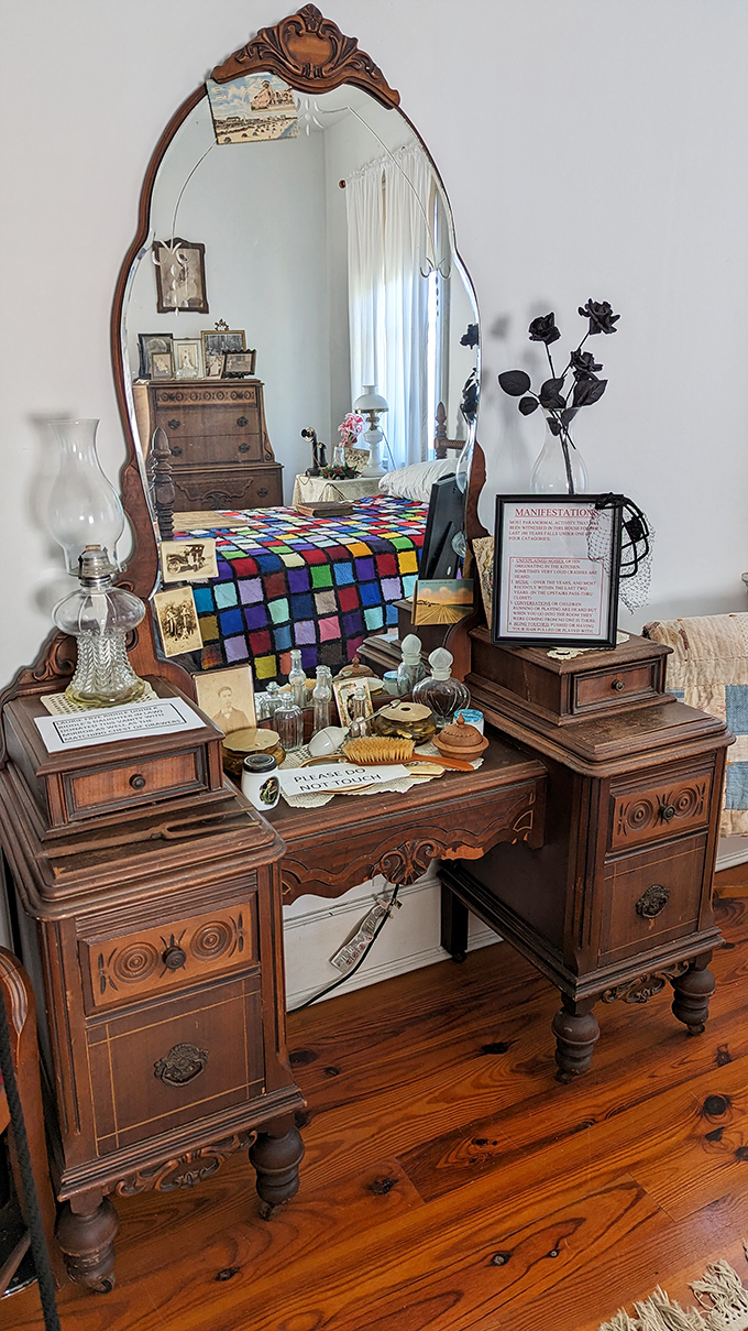The vanity where turn-of-the-century beauty rituals happened &ndash; note the "Manifestation" sign warning visitors that mirrors might show more than your reflection.