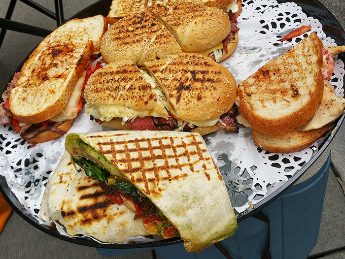 A sandwich platter that makes sharing both necessary and nearly impossible. That crispy, grilled exterior is the gateway to flavor country.