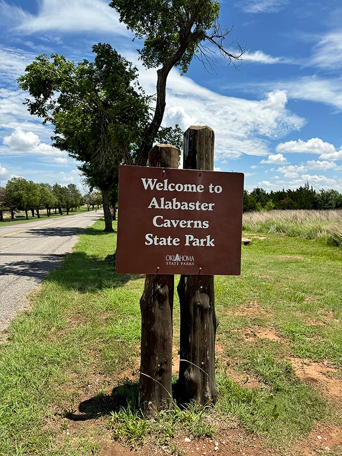 No velvet rope or fancy entrance needed. This humble sign marks the threshold between ordinary Oklahoma landscape and extraordinary underground adventure.