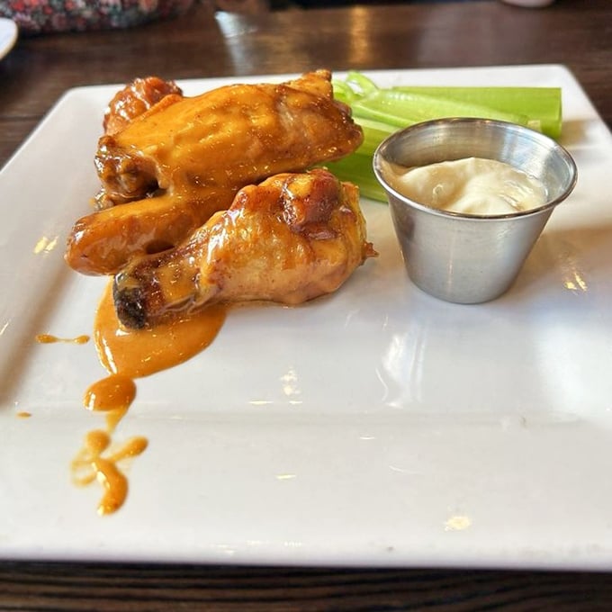 Wings that make you question why you ever settled for lesser versions. The thin-sliced onions add a bite that cuts through the richness perfectly. 