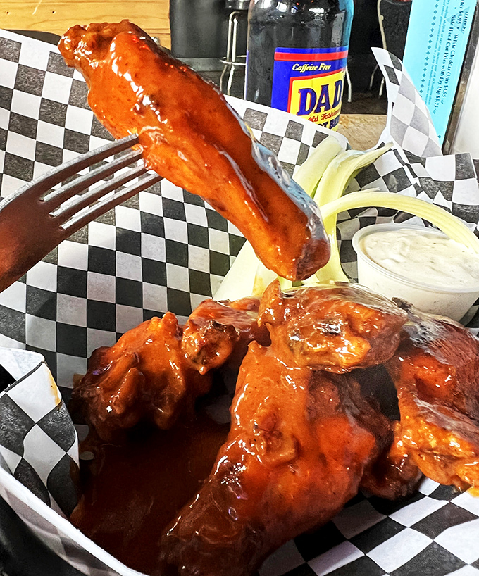 Wings that don't just get sauced&mdash;they get baptized. Glistening with tangy heat and served with cooling ranch, they're a study in delicious contrasts.